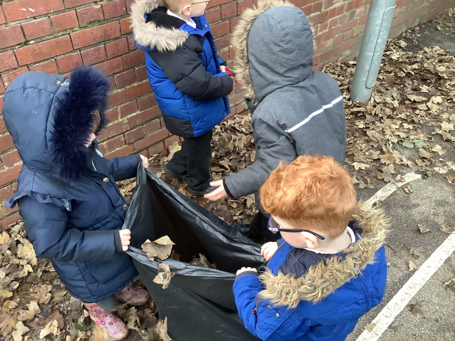 Litter picking and collecting leaves in EYFS | Carcroft School